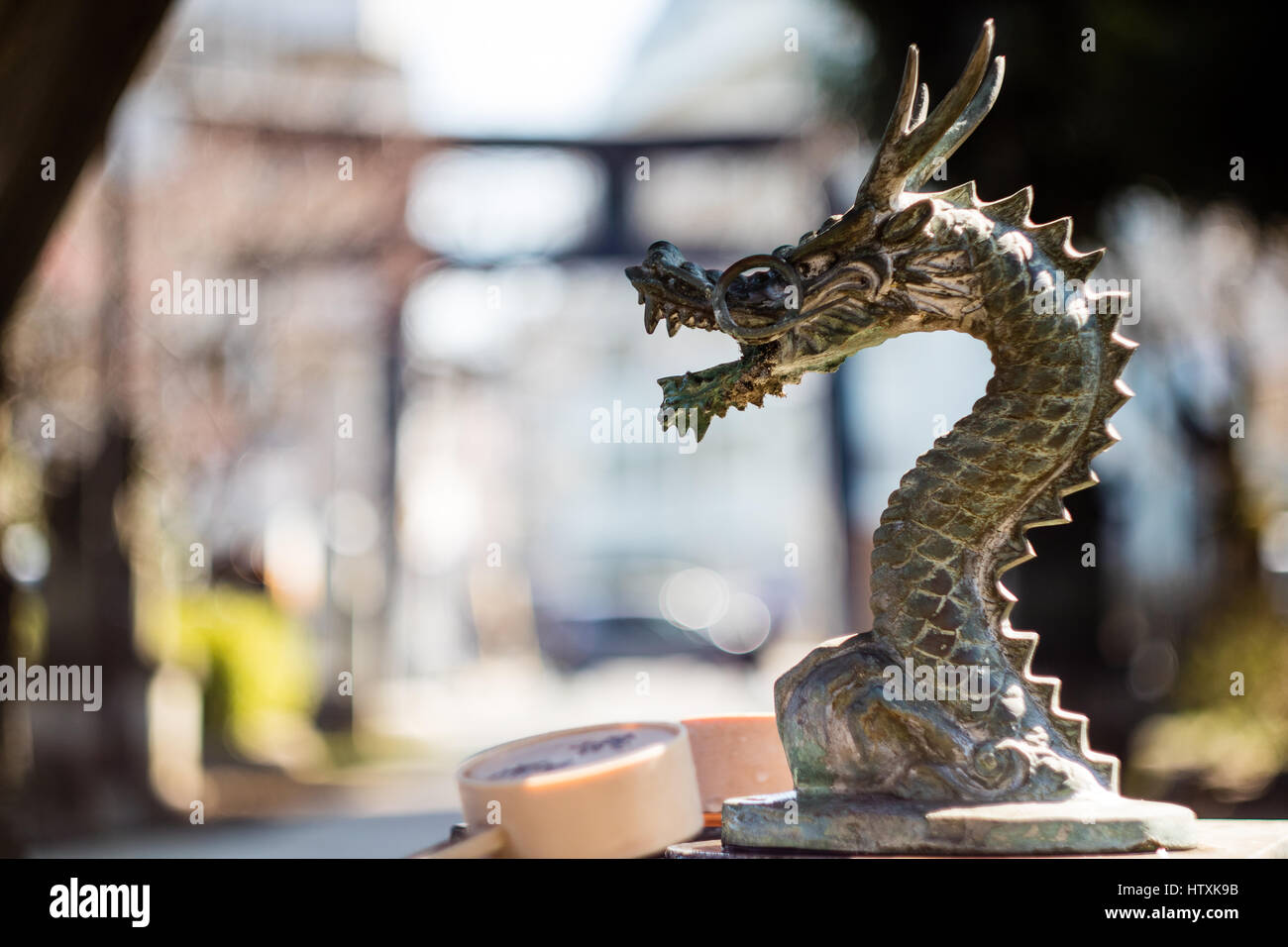 A dragon shaped fountain at a Japanese Shinto Shrine Stock Photo - Alamy