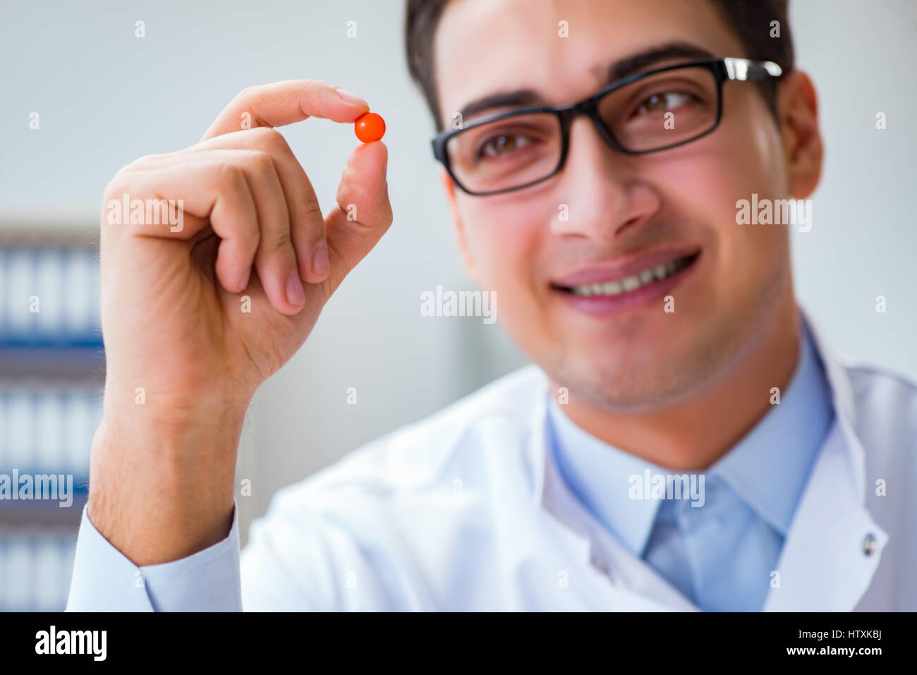 Doctor holding medicines in the lab Stock Photo - Alamy