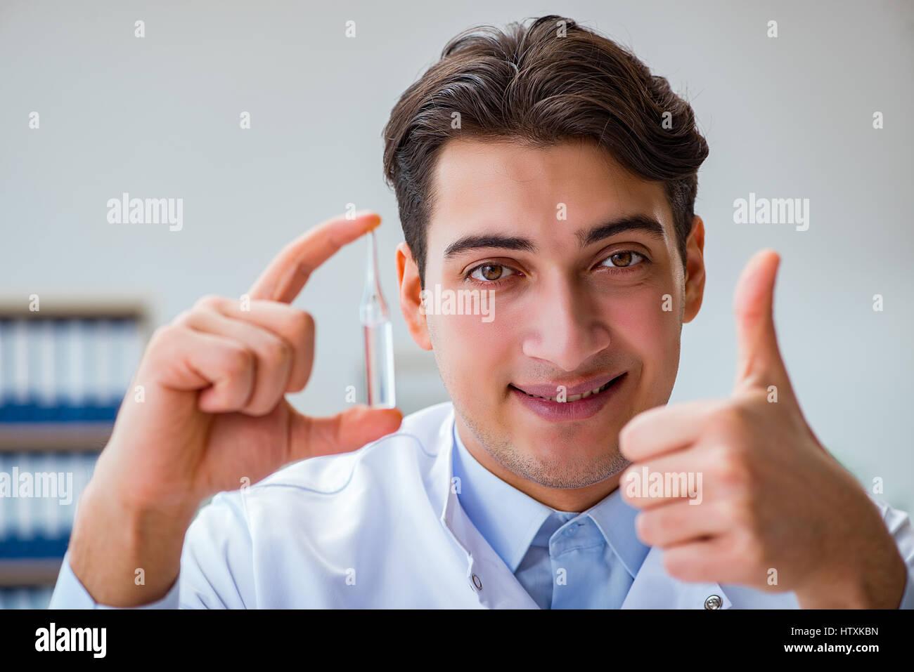 Doctor holding medicines in the lab Stock Photo - Alamy