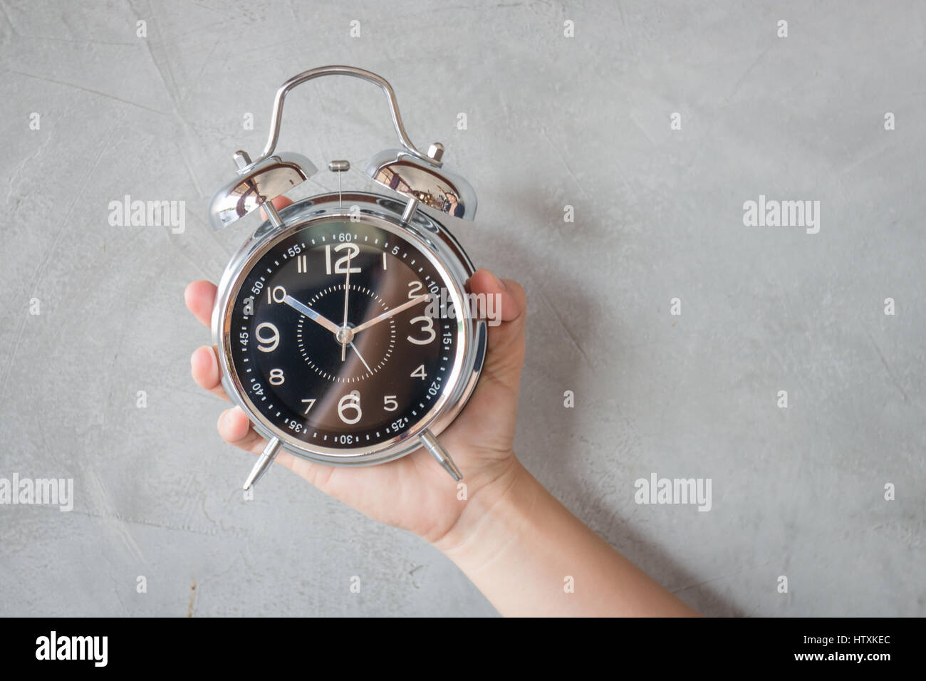 Woman Hand On Alarm Clock , stock photo Stock Photo - Alamy