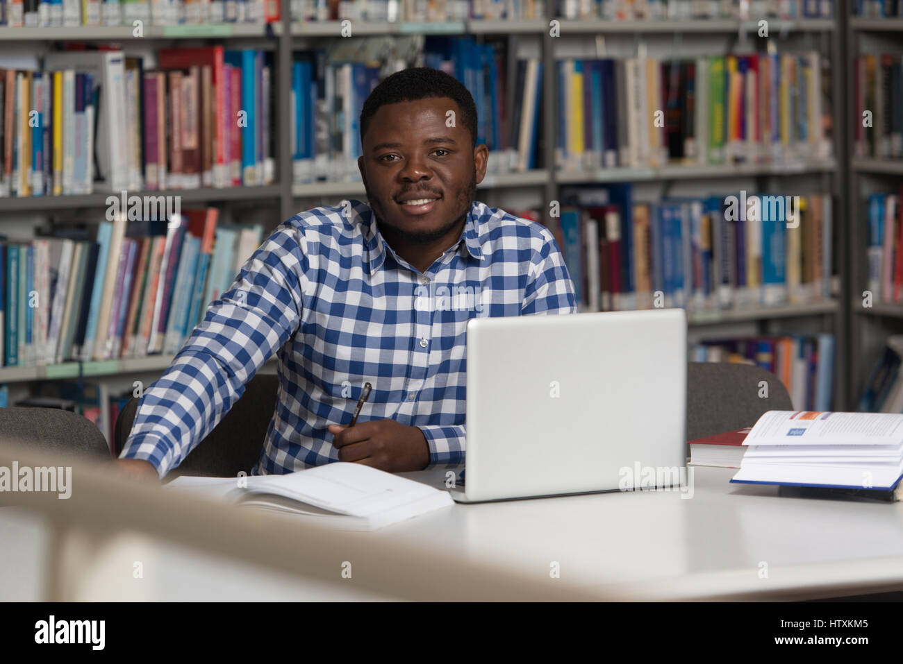 Portrait Of African Clever Student With Open Book Reading It In College ...