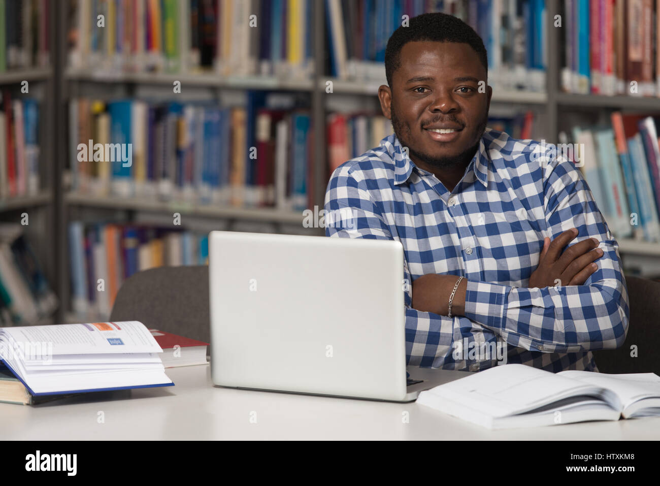 In library handsome african male hi-res stock photography and images ...