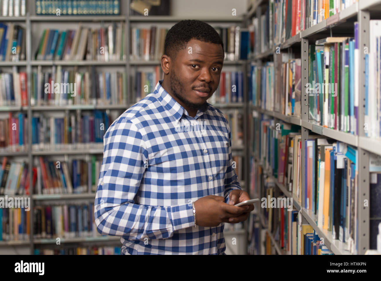 Student using mobile in classroom hi-res stock photography and images ...