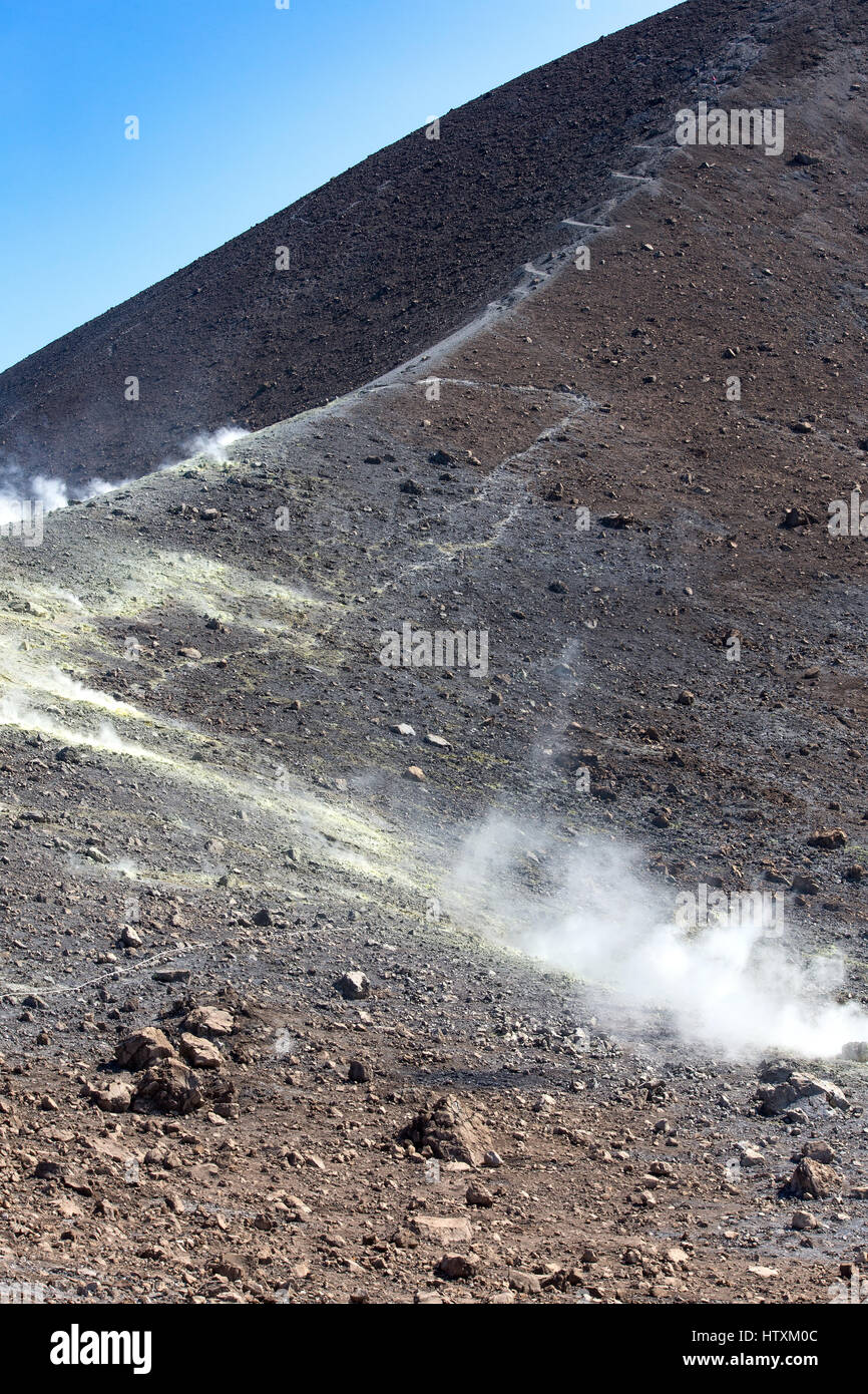 Sulfur haze and crystals on the rocks. Volcano Island in the ...
