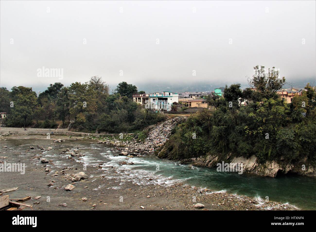 Garbage dump in river (Uttarakhand Stock Photo - Alamy