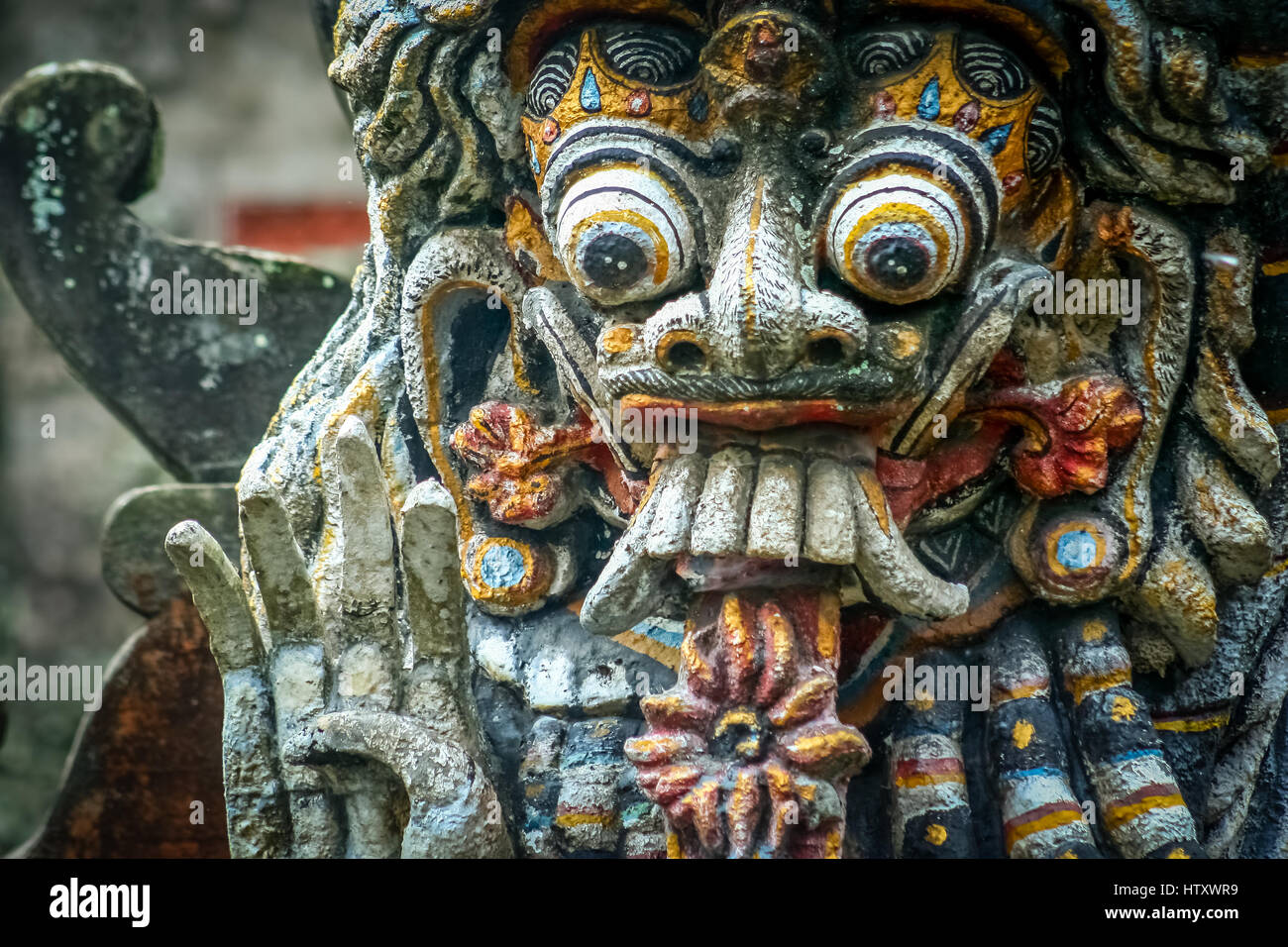 Scary sculpture in one of the temples in northern park of Bali ...