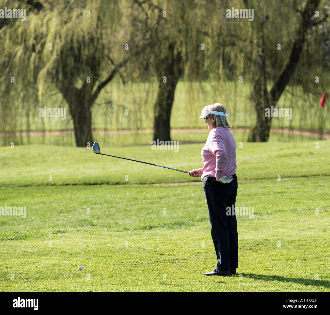 Retired elderly lady playing golf hi-res stock photography and images ...