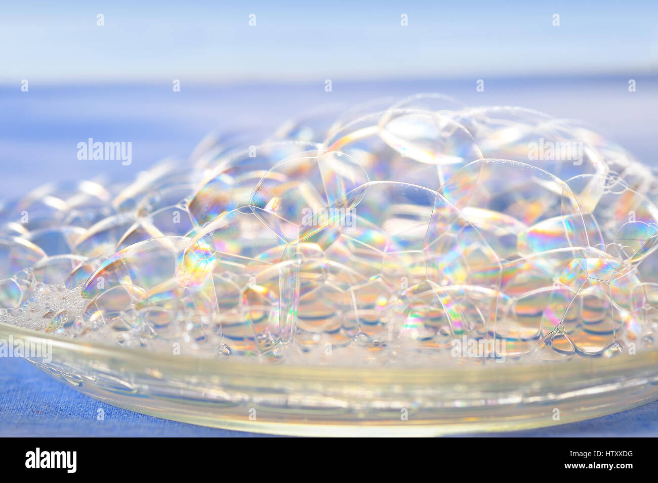 Macro soap bubbles on blue background Stock Photo - Alamy