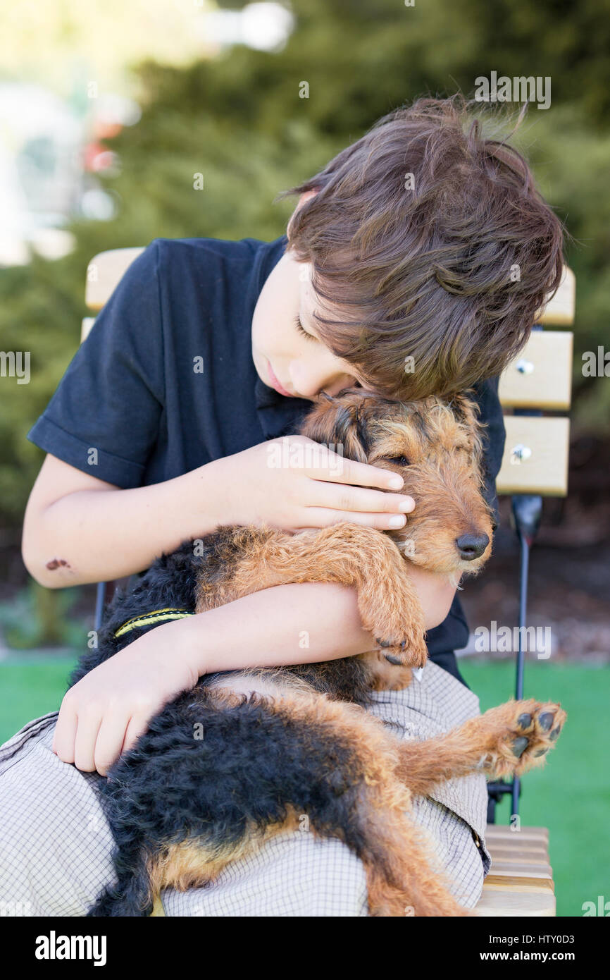 Boy and his beloved dog, welsh terrier. Love portrait. Child cuddling ...