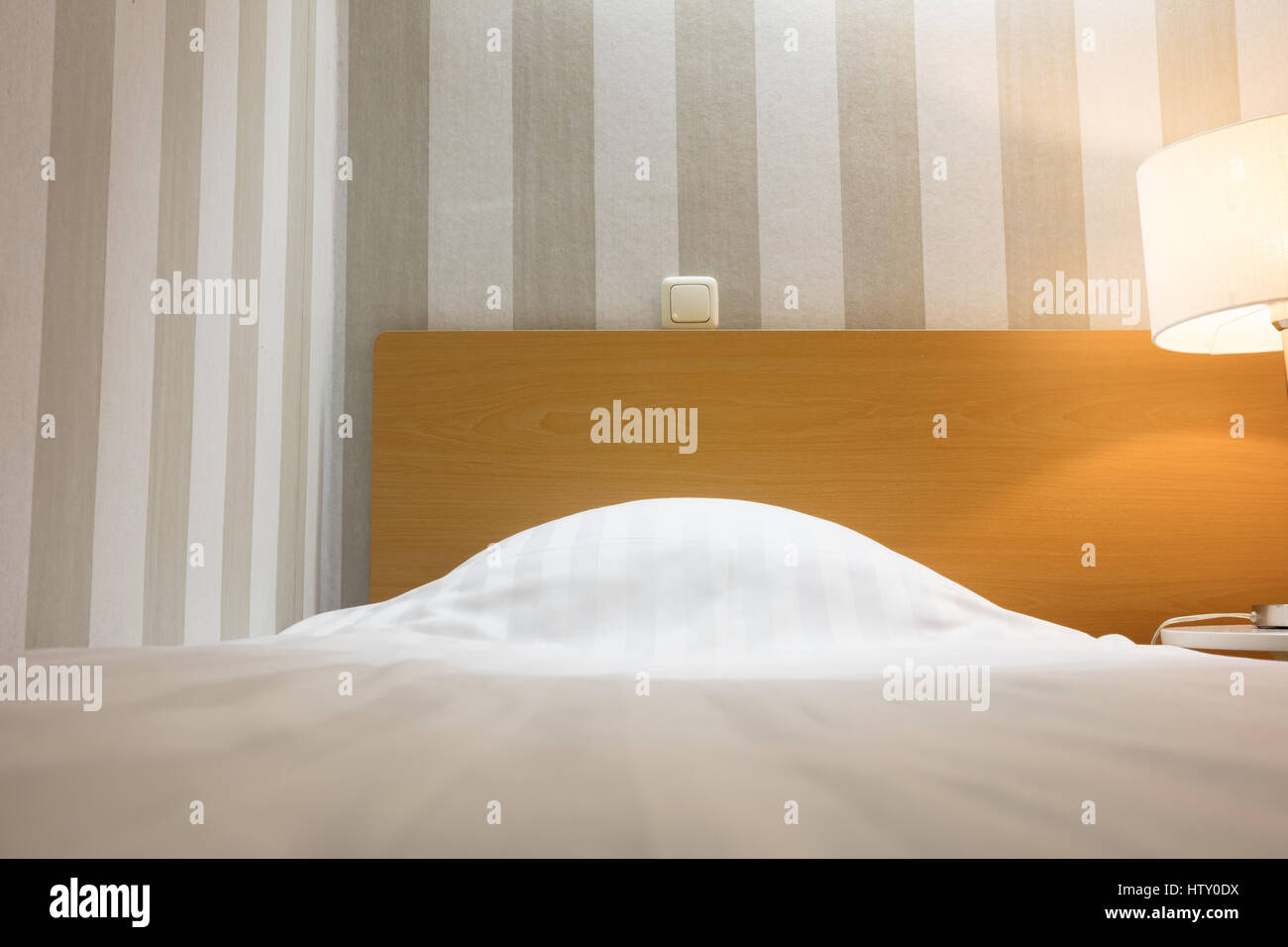 Simple small hotel room (classic), single bed Stock Photo - Alamy