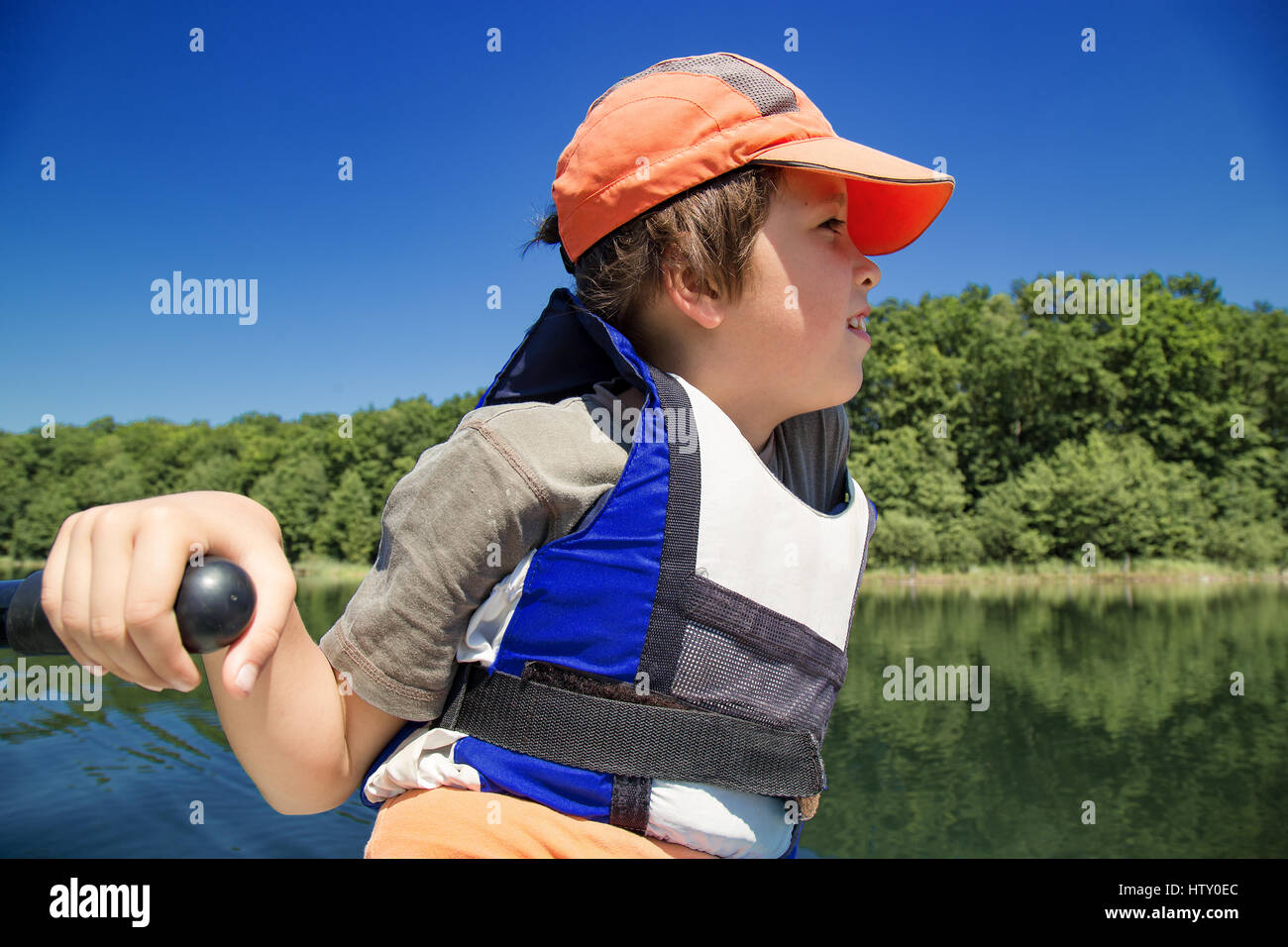 Kid driving boat hi-res stock photography and images - Alamy