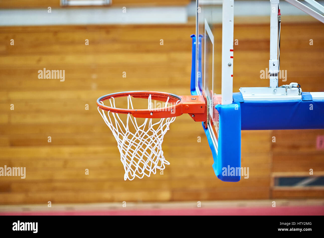 Basketball hoop in sports hall closeup Stock Photo - Alamy