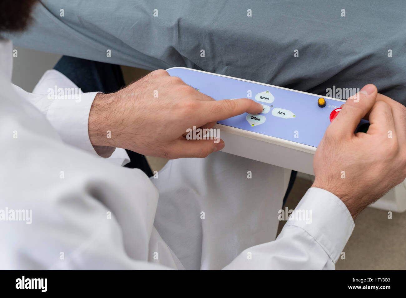 Doctor Using Control Panel Of Bed In Hospital Stock Photo - Alamy