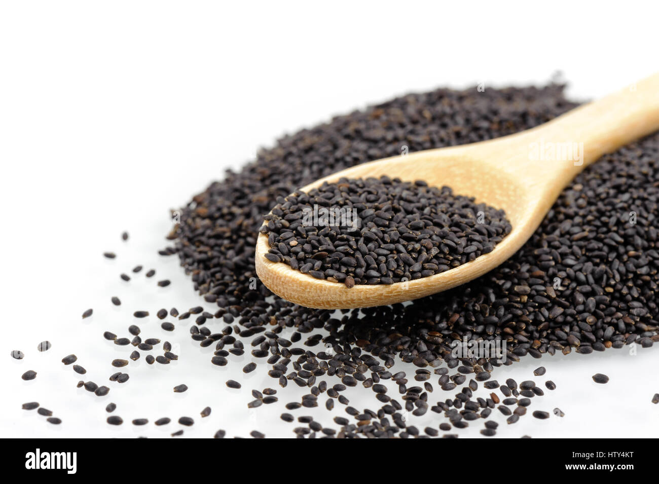 closeup heap of sweet basil seeds isolated on white background Stock ...