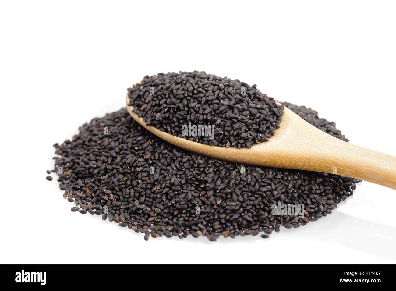 closeup heap of sweet basil seeds isolated on white background Stock ...