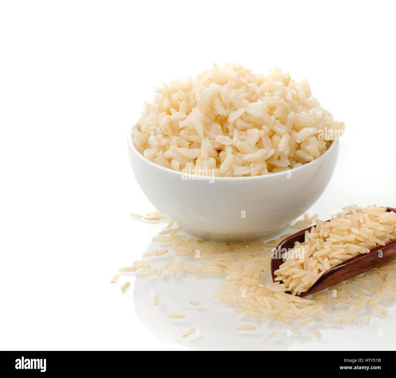 cooked and uncooked brown rice over white background Stock Photo - Alamy