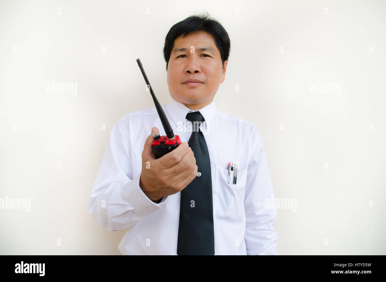 a man with radio tranceiver for communication Stock Photo - Alamy