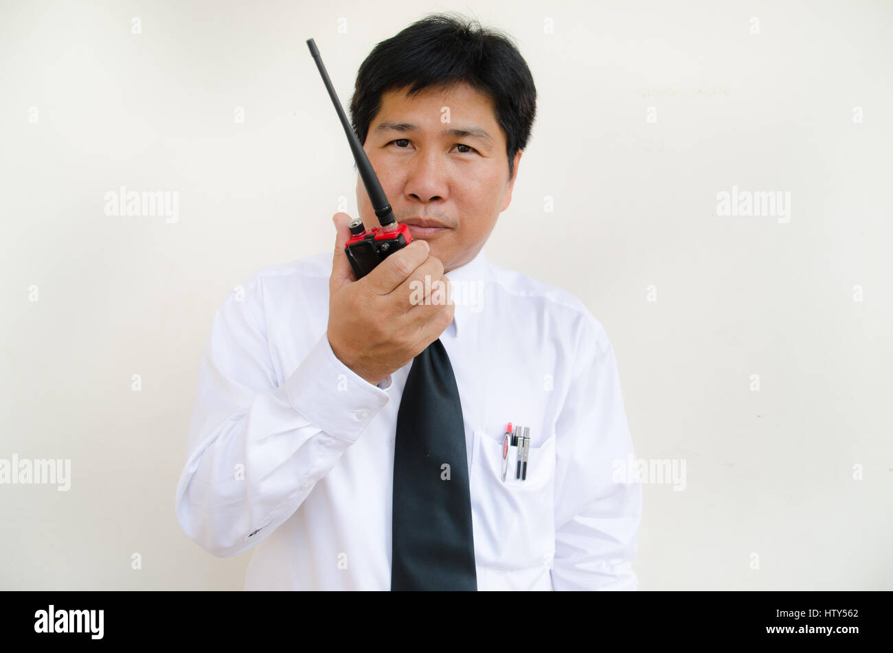 a man with radio tranceiver for communication Stock Photo - Alamy