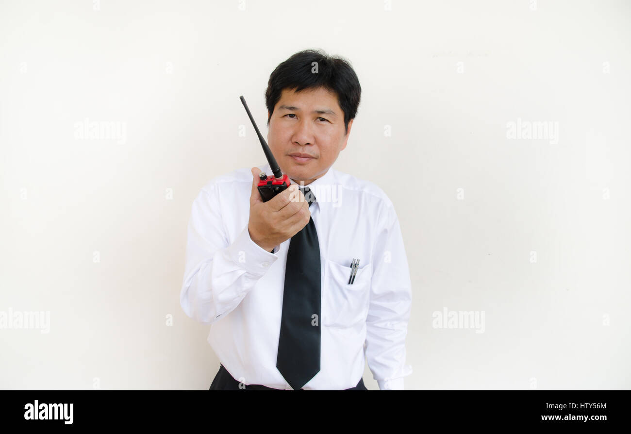 a man with radio tranceiver for communication Stock Photo - Alamy