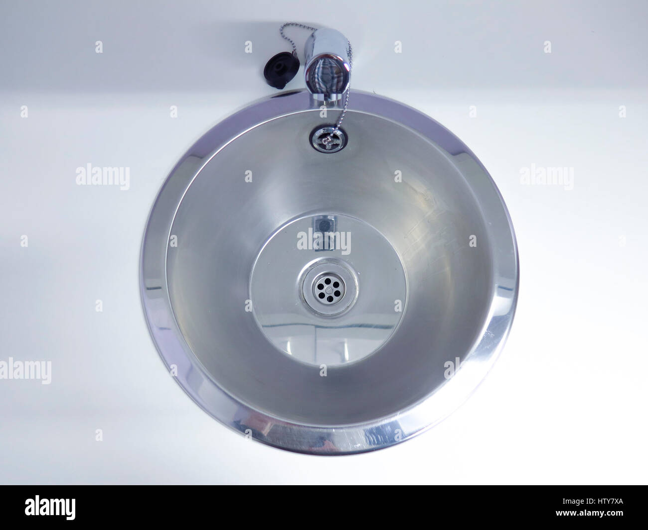 Circular stainless steel sink Stock Photo - Alamy