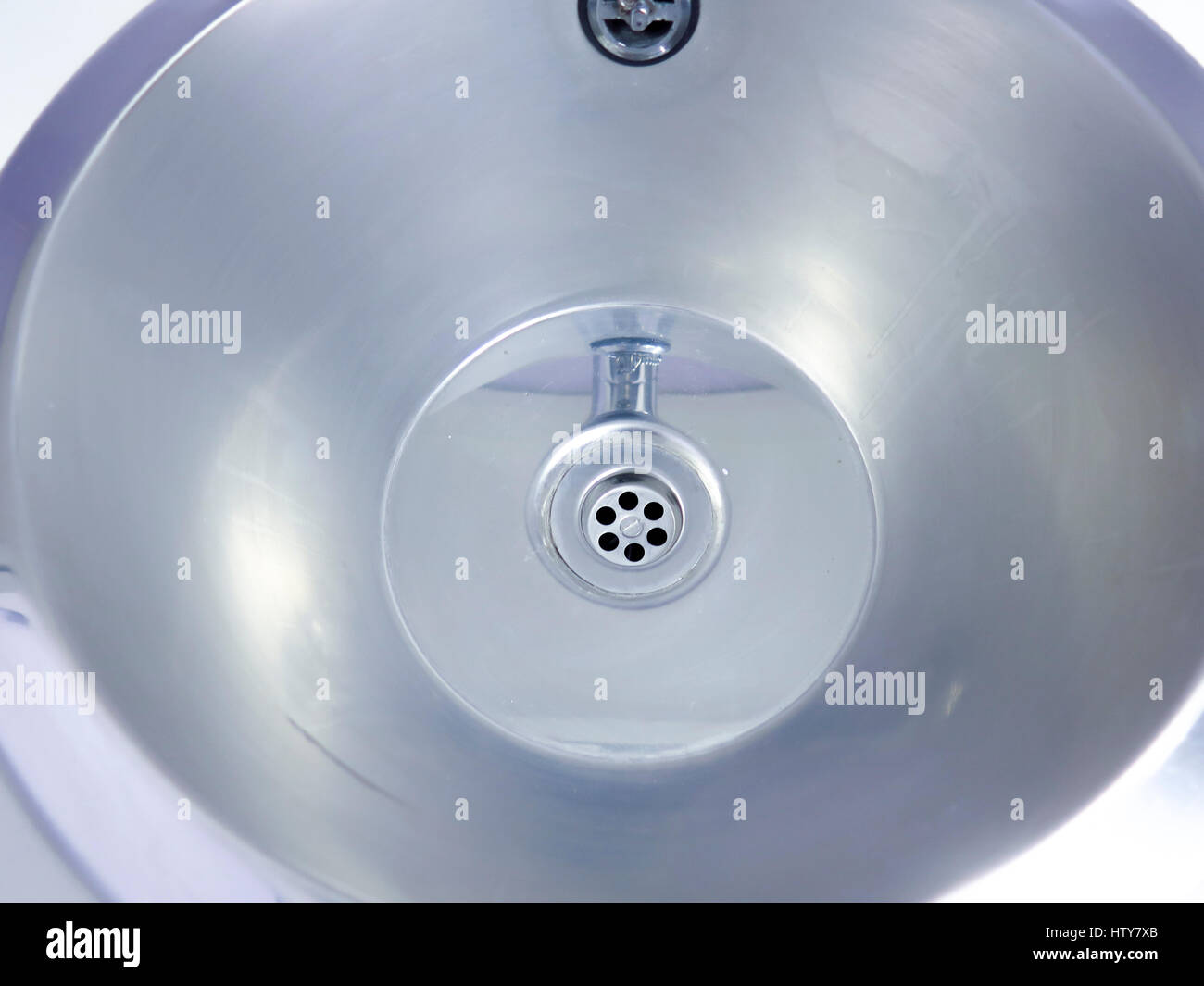 Circular stainless steel sink Stock Photo - Alamy