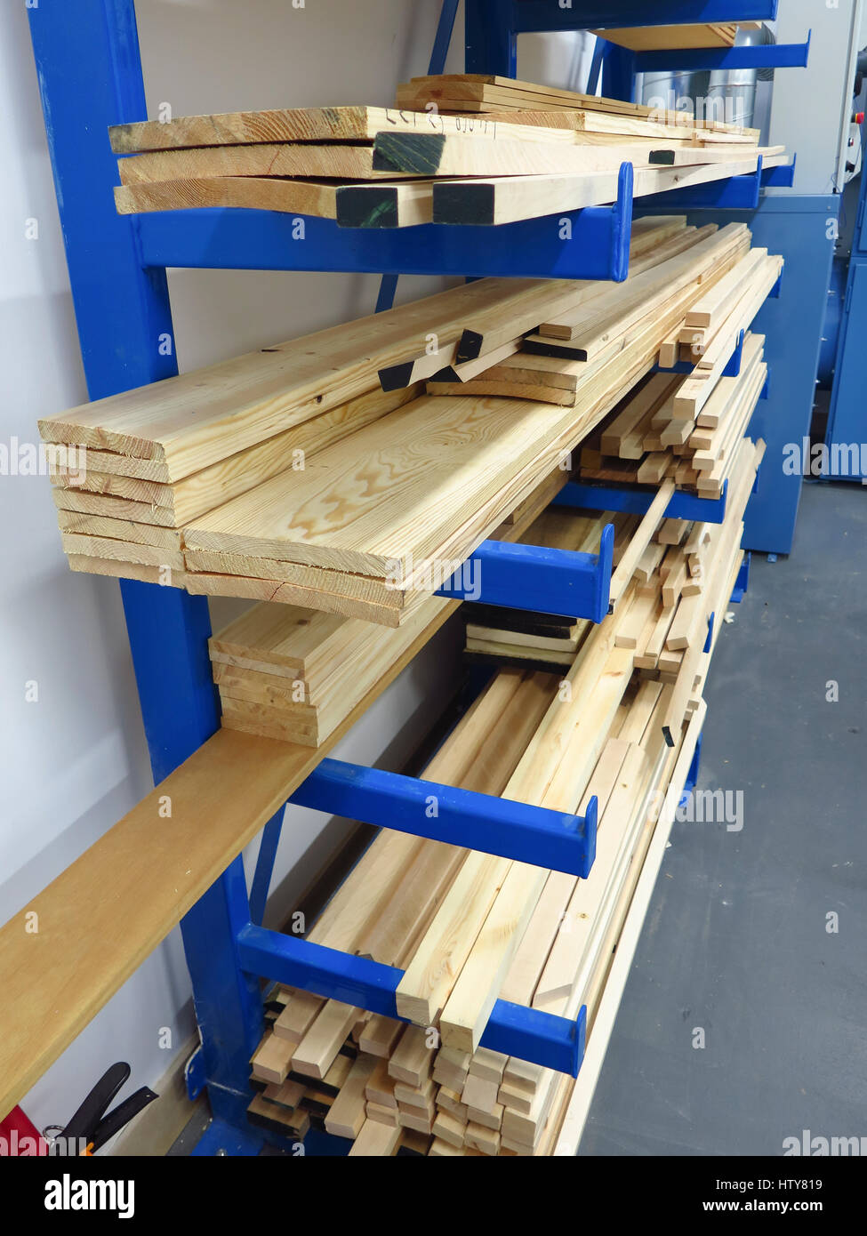 Raw timber stored on racking Stock Photo - Alamy