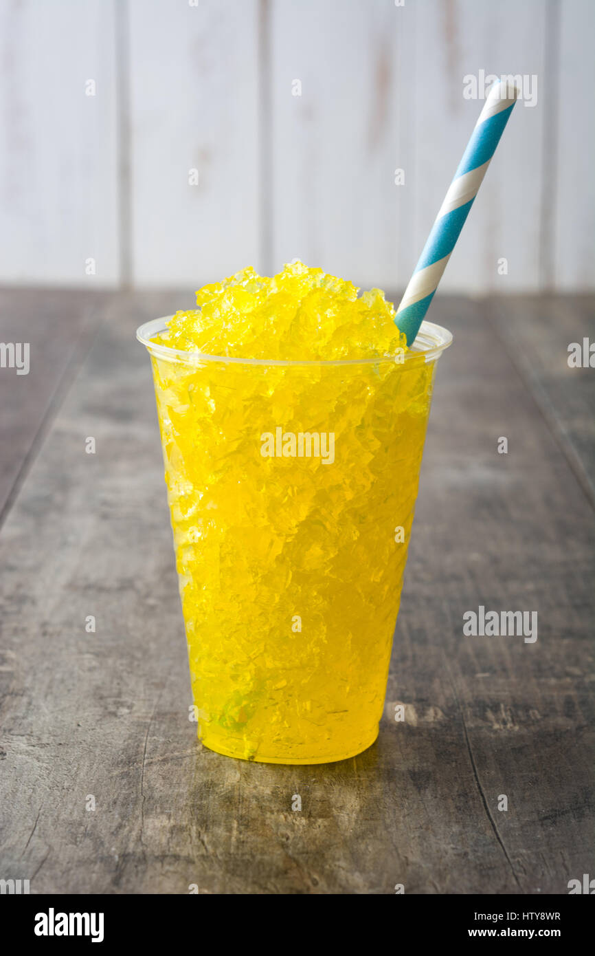 Yellow lemon slushie on rustic wood Stock Photo - Alamy