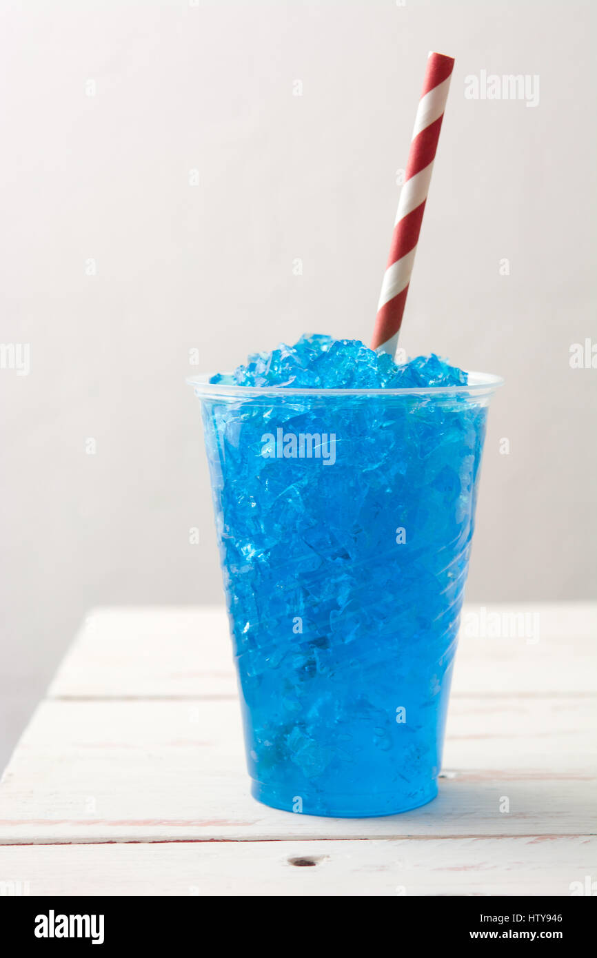 Blue summer slushie on white wooden table Stock Photo - Alamy