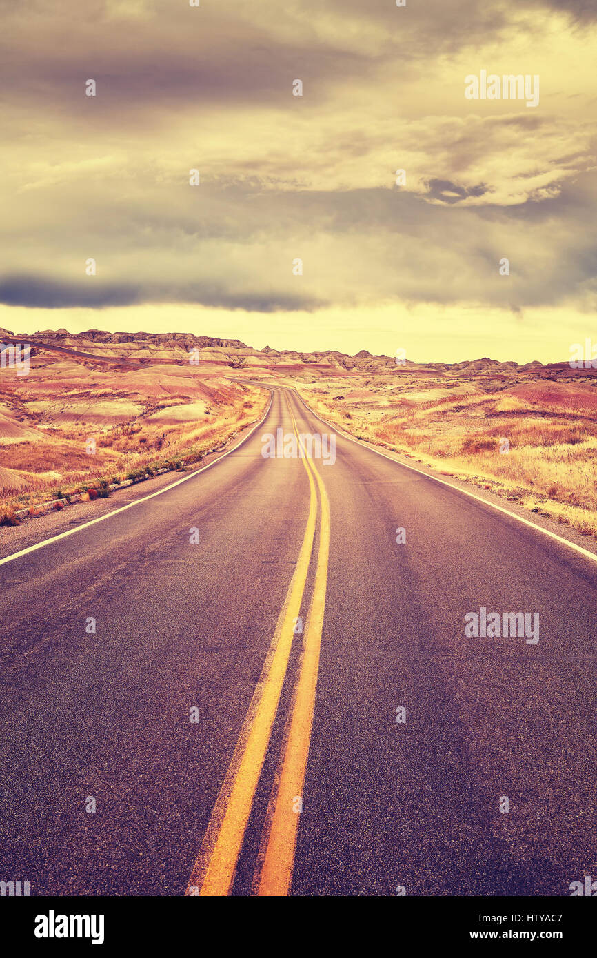 Color toned endless desert road before storm, travel background Stock ...