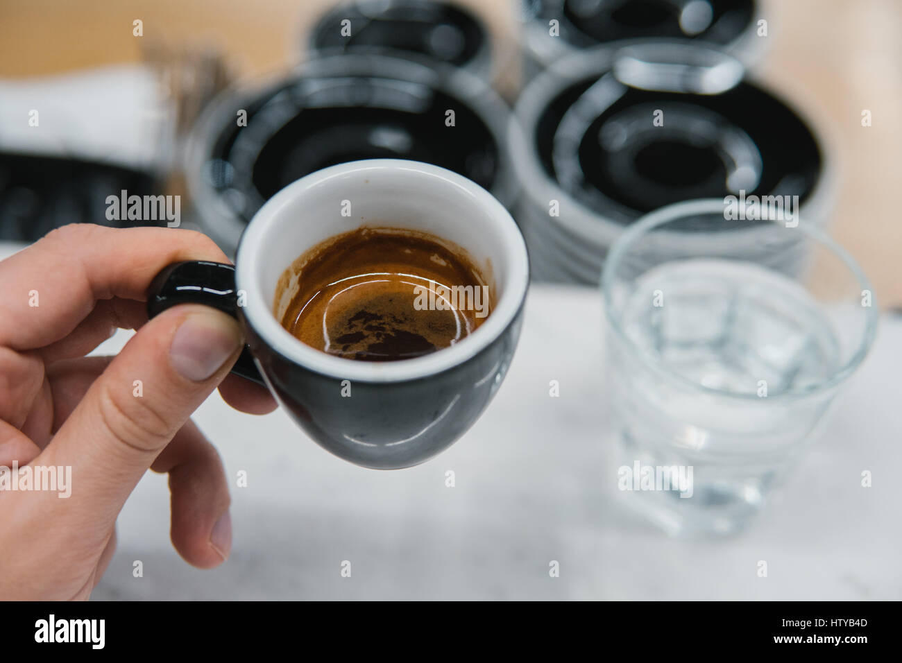 cup of coffee in a hand Stock Photo - Alamy