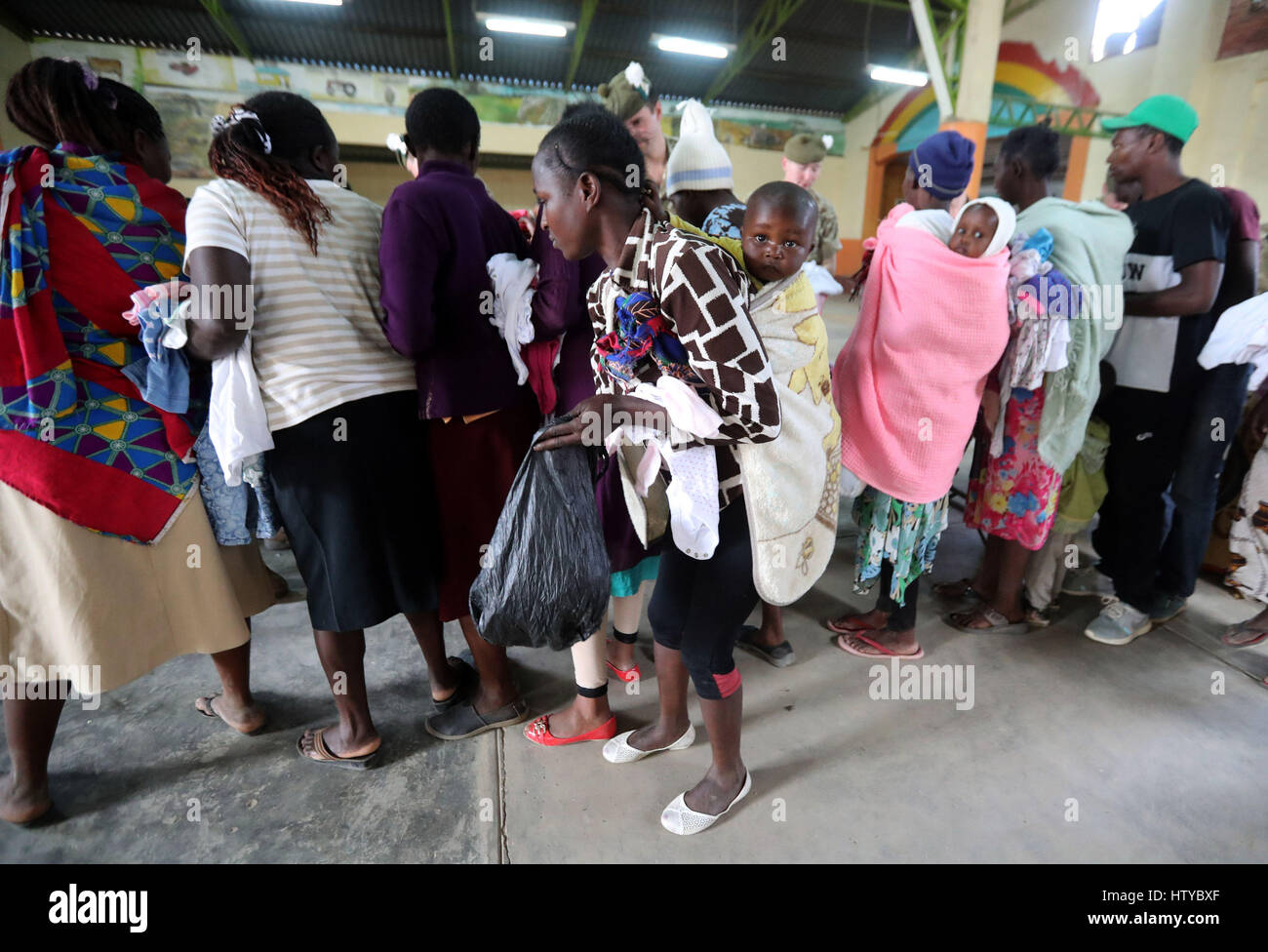 Handing out donated clothes hi-res stock photography and images - Alamy