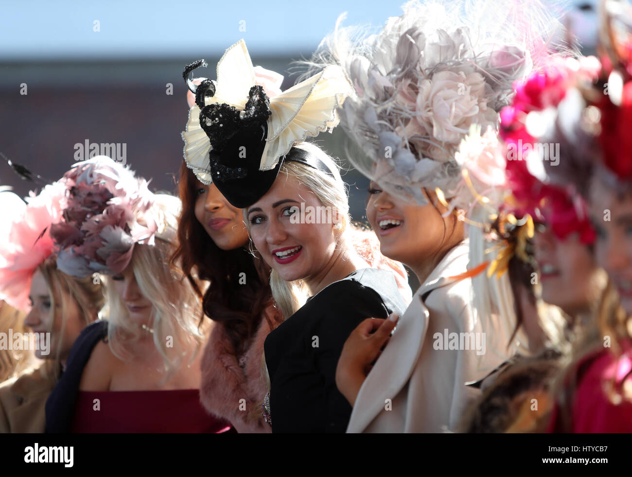 Female racegoers pose for photographers to the start of Ladies Day of ...