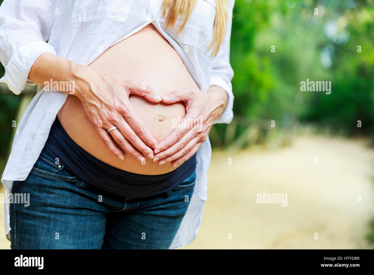 Heart Hands On Pregnant Belly at Daniel Epperson blog