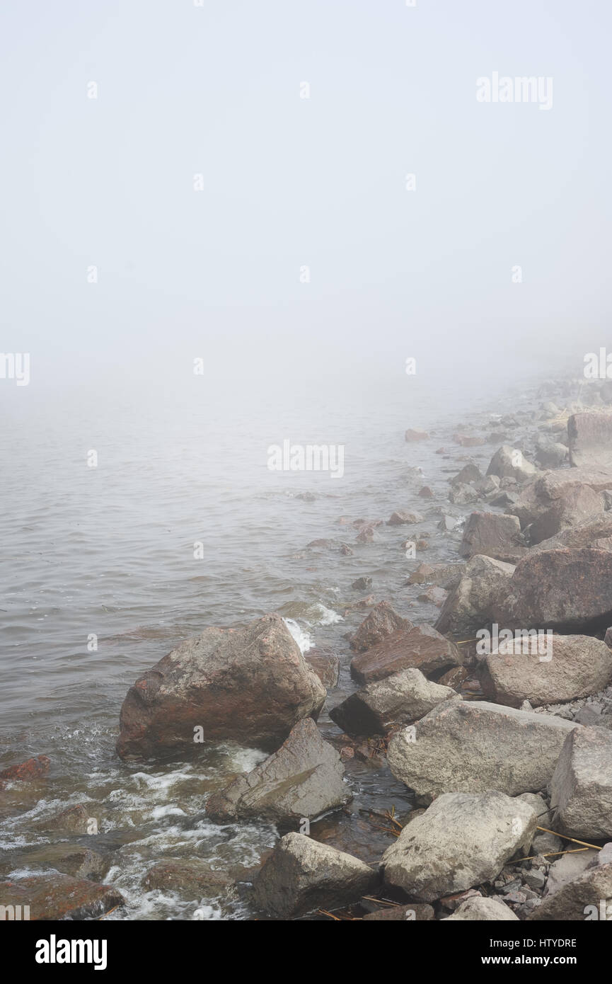 Landscape with fog over lake Stock Photo - Alamy