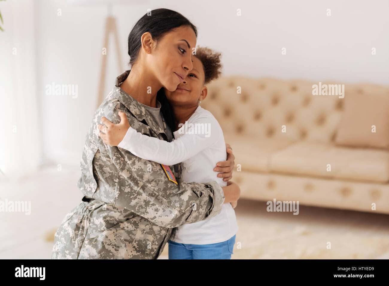 Adorable mother and child hugging each other Stock Photo - Alamy