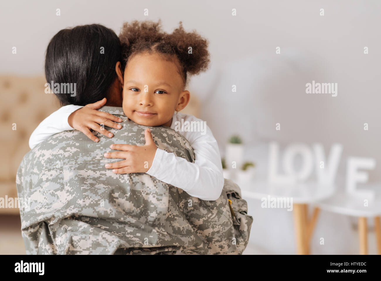 Loving mom returning home to her child Stock Photo - Alamy