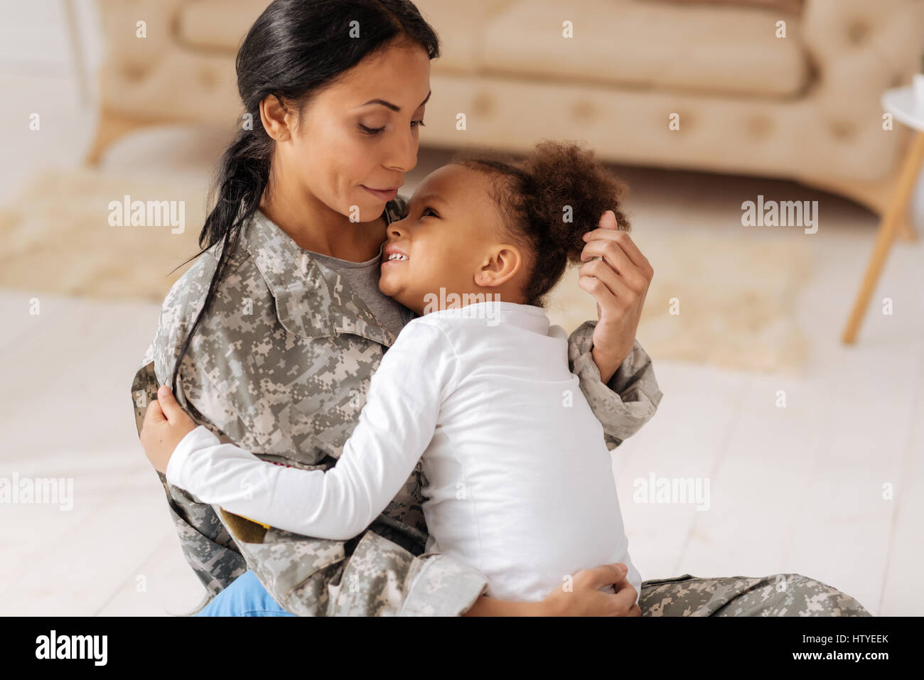 Graceful woman and her cute child sharing their love Stock Photo - Alamy