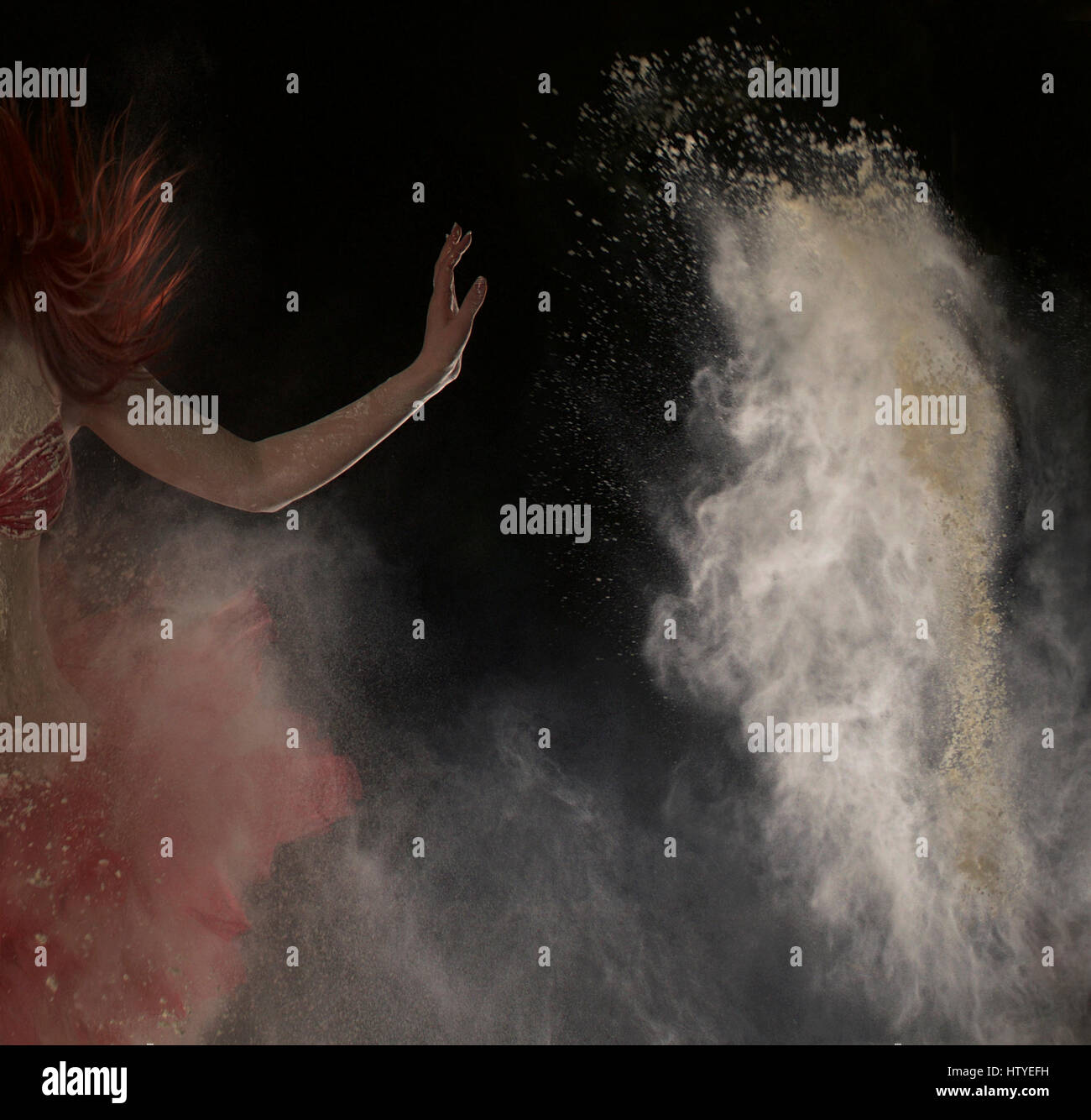 Woman dancing with powder Stock Photo - Alamy