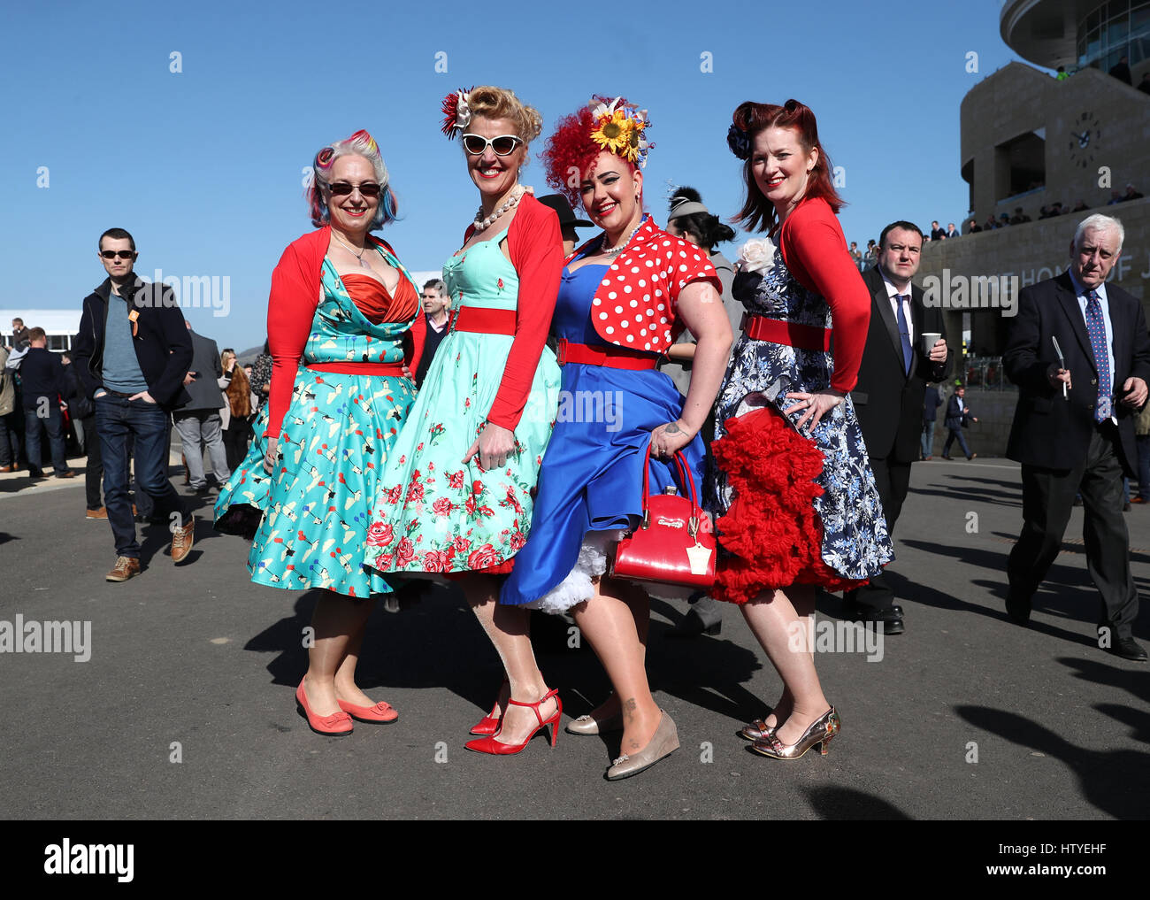 Female racegoers pose for photographers during Ladies Day of the 2017 ...