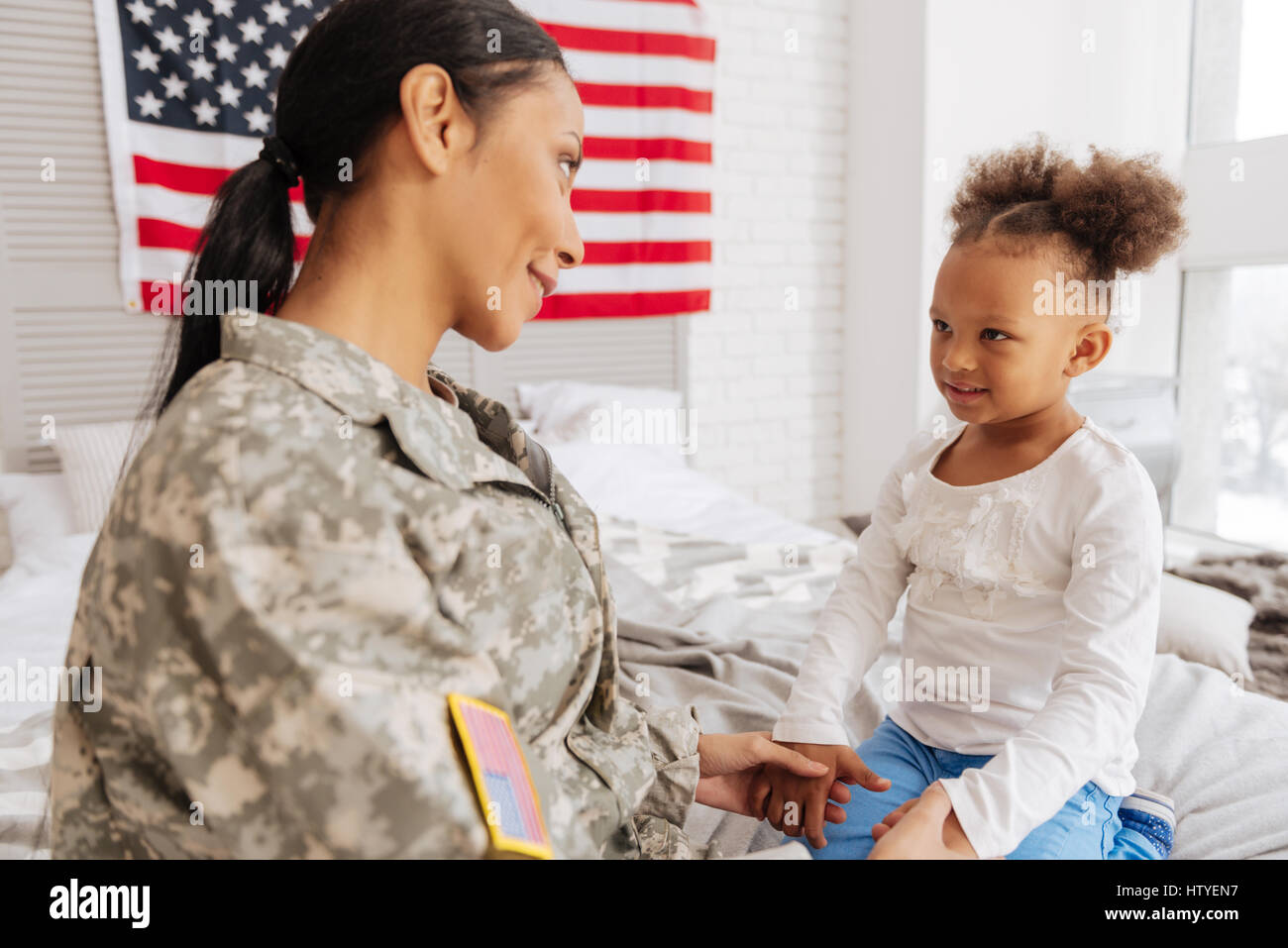 Curious little lady asking her mom questions Stock Photo - Alamy