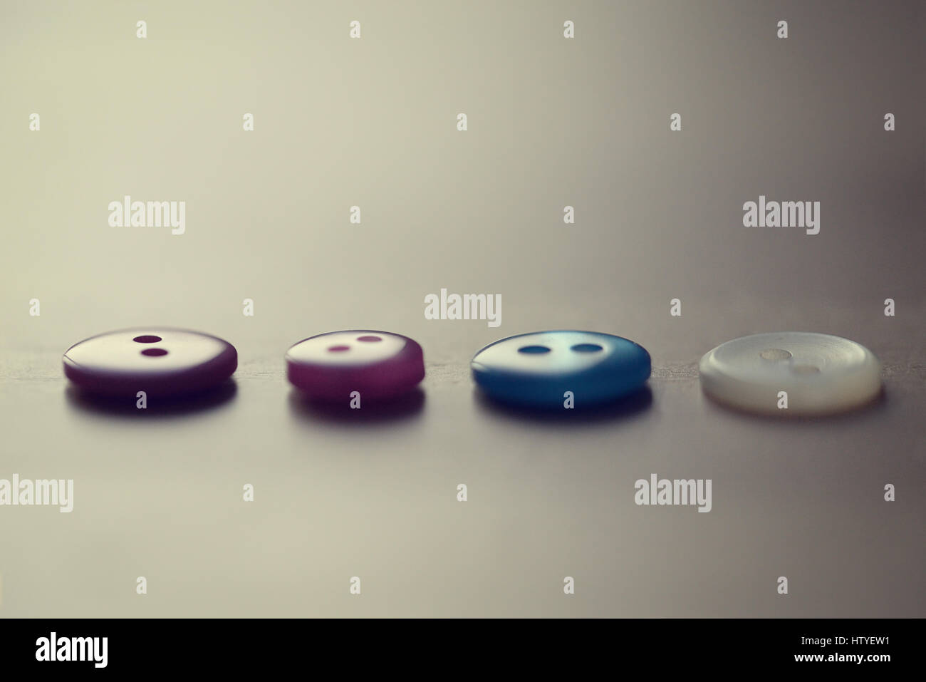 Four buttons in a row Stock Photo - Alamy