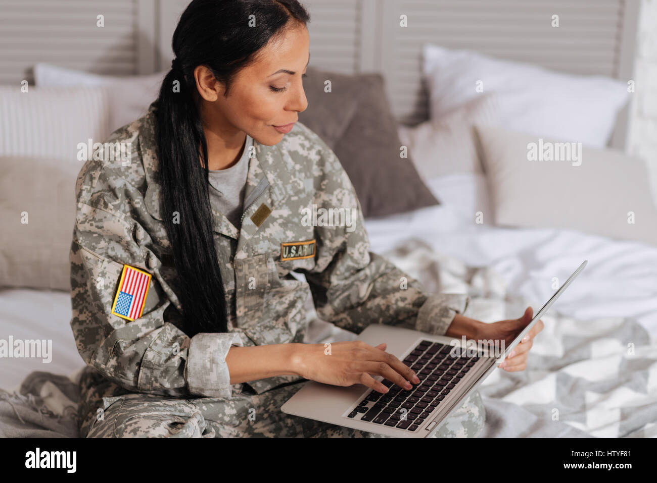 Focused inspired woman typing an email Stock Photo - Alamy