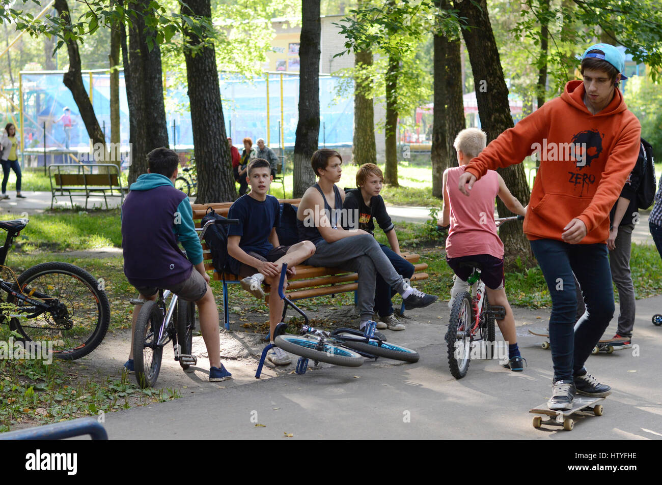 KOVROV, RUSSIA - AUGUST 2, 2015: Teens on a BMX bikes, skateboards, and scooters in park named ...