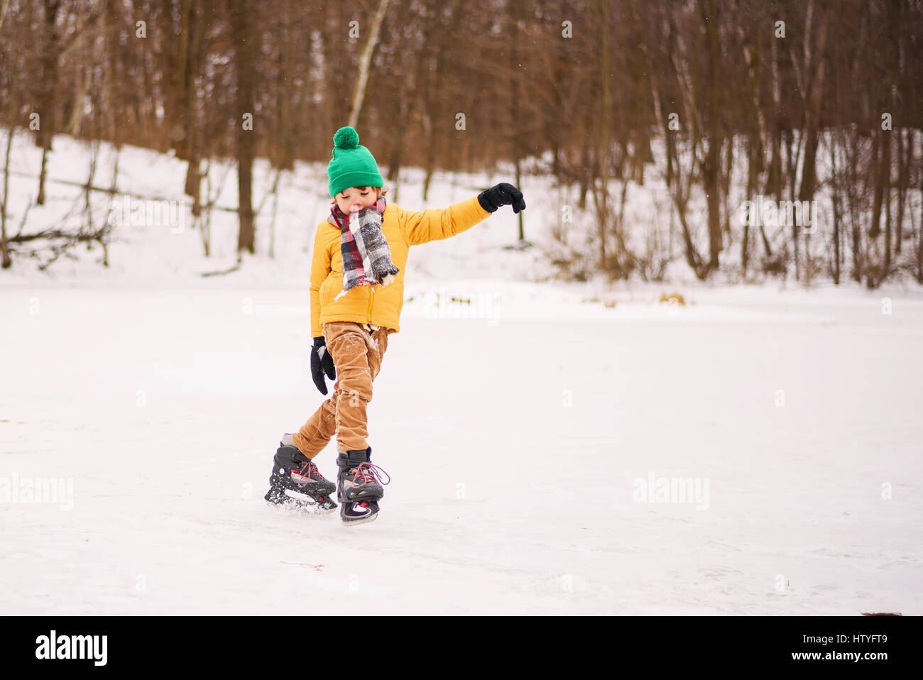 Boy on ice hi-res stock photography and images - Alamy