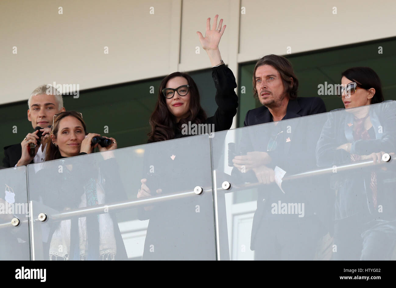 Liv Tyler waves during Ladies Day of the 2017 Cheltenham Festival at ...