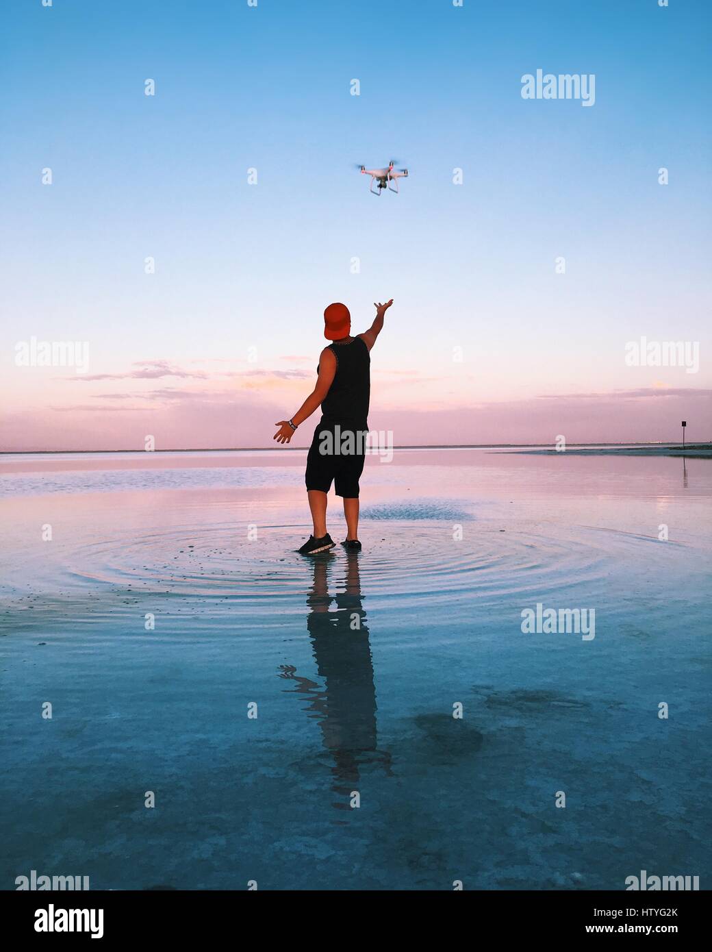 Boy playing with a drone, Bonneville Salt Flats, Utah, United States ...