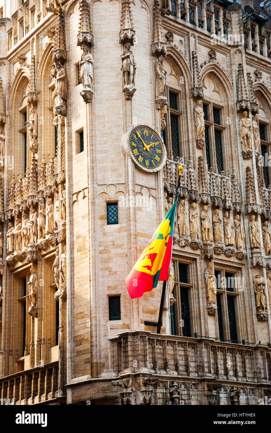 Brussels city hall with flag and clock Stock Photo - Alamy