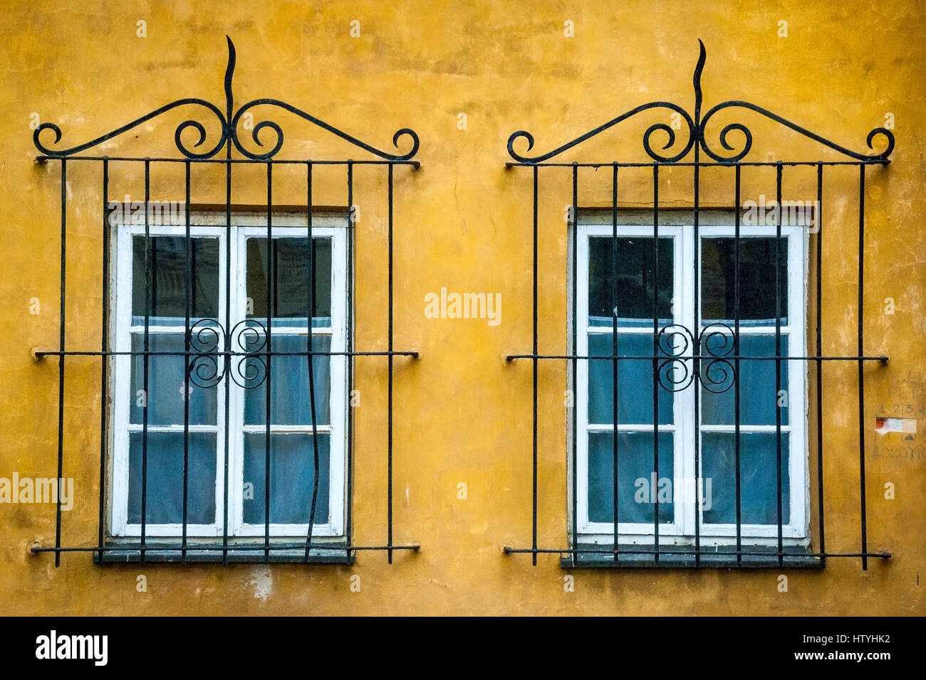 Two old windows with ornameltal metal lattice Stock Photo - Alamy
