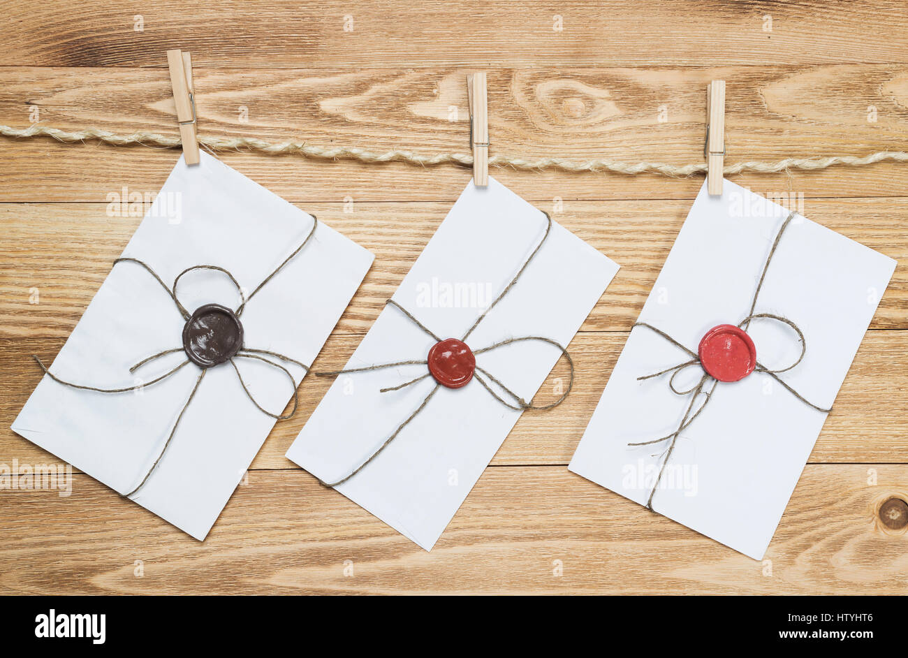 Mail envelope on rope Stock Photo - Alamy