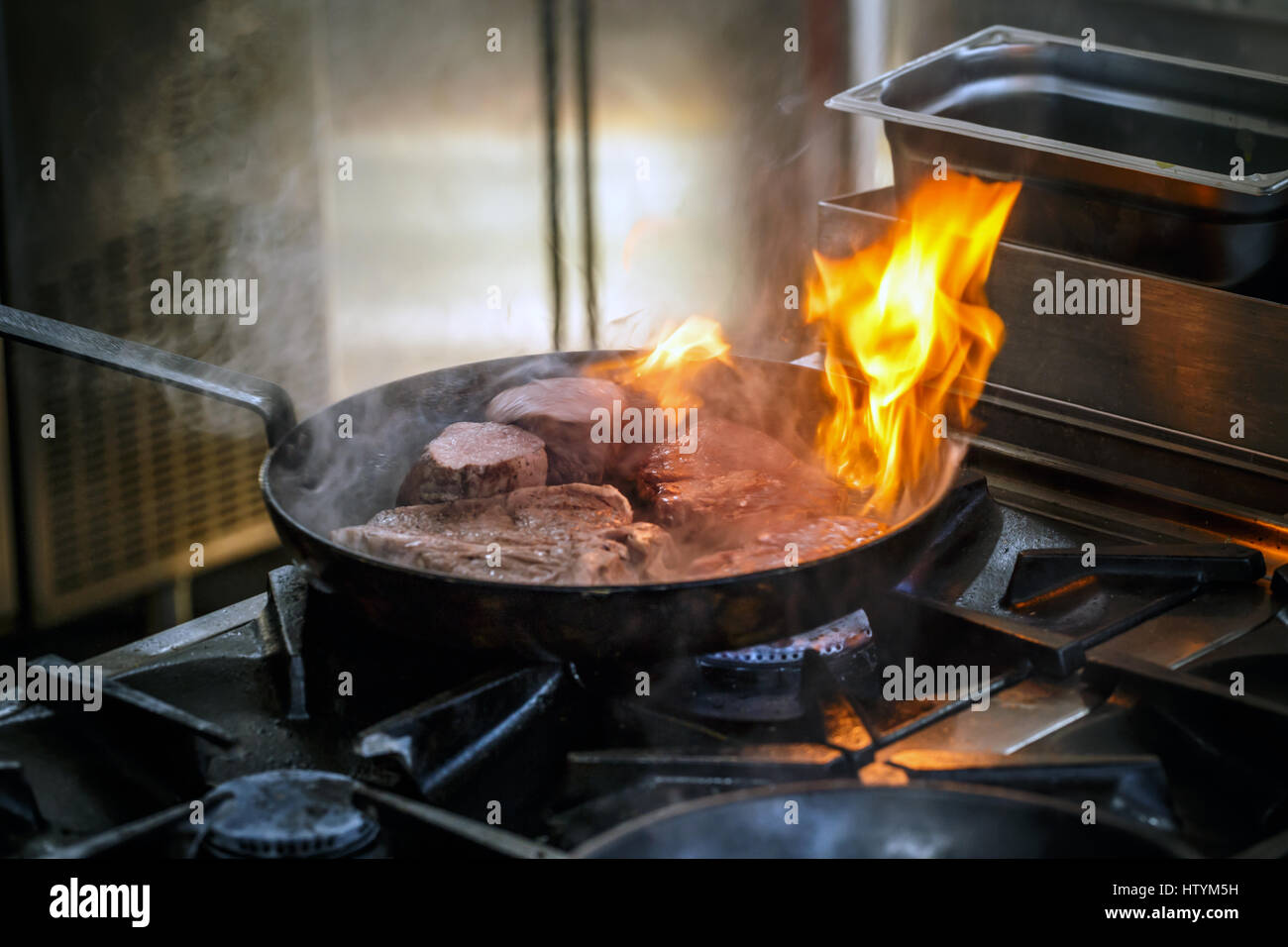 Cooking meat on fire chef hi-res stock photography and images - Alamy